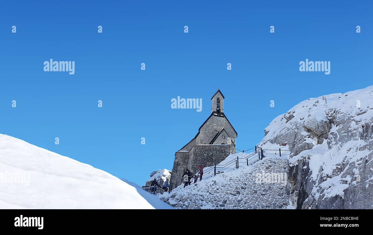 small old church on mountain. Beautiful alpine mountains in winter ...