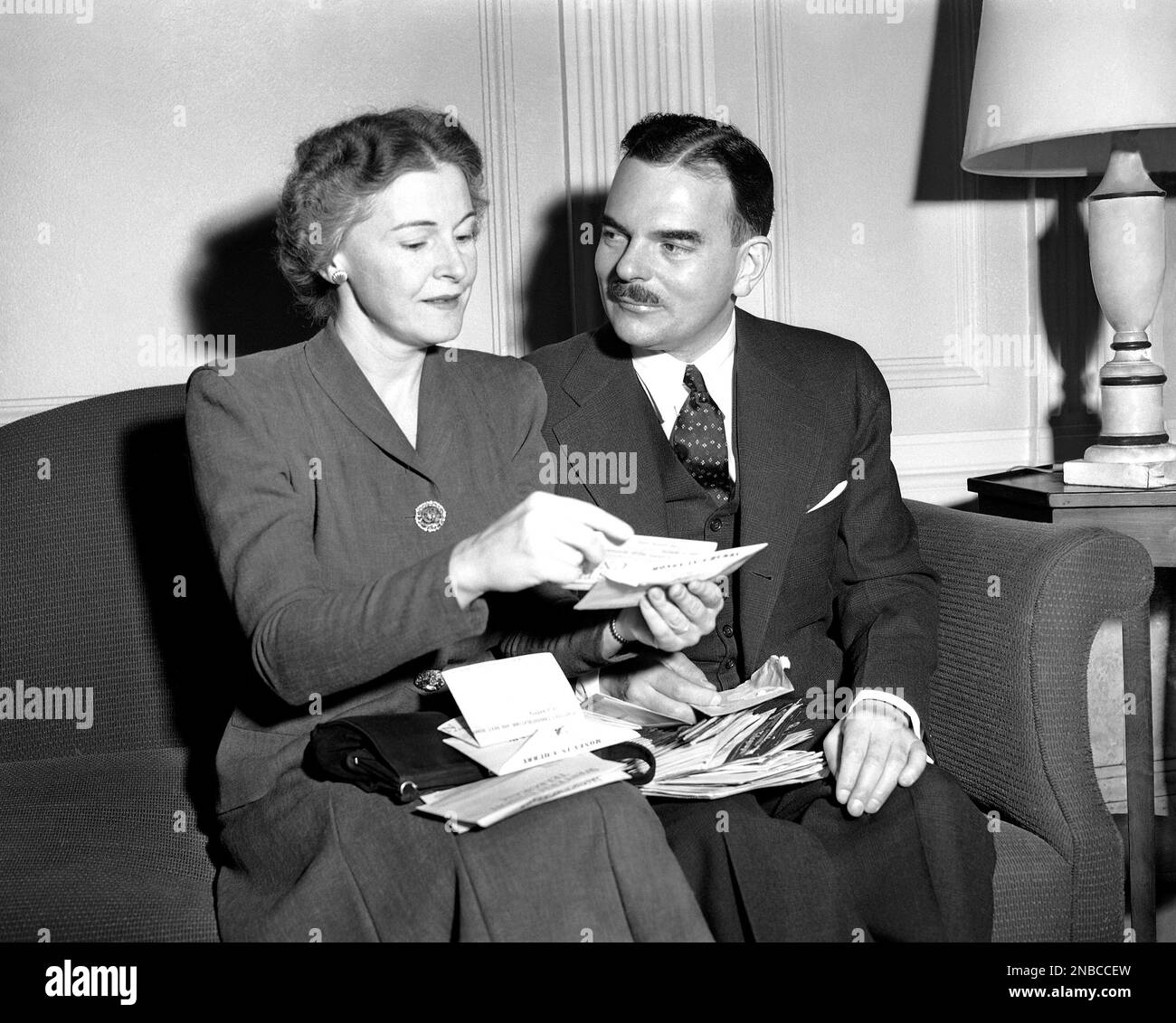 Mr. Thomas E. Dewey and Mrs. Frances Dewey open telegrams of ...