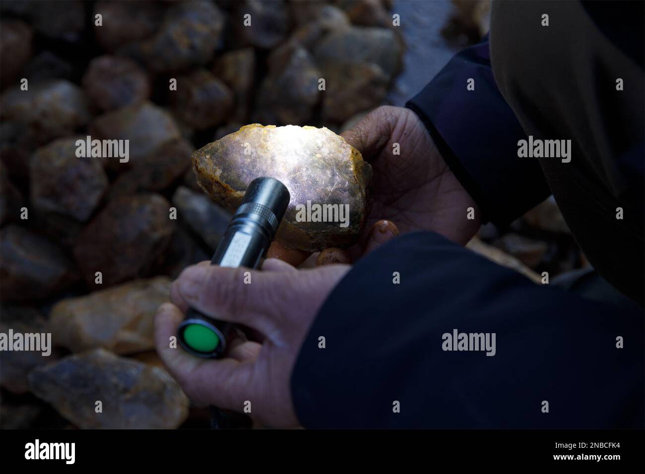 LIANYUNGANG, CHINA - FEBRUARY 14, 2023 - A customer selects a crystal ...