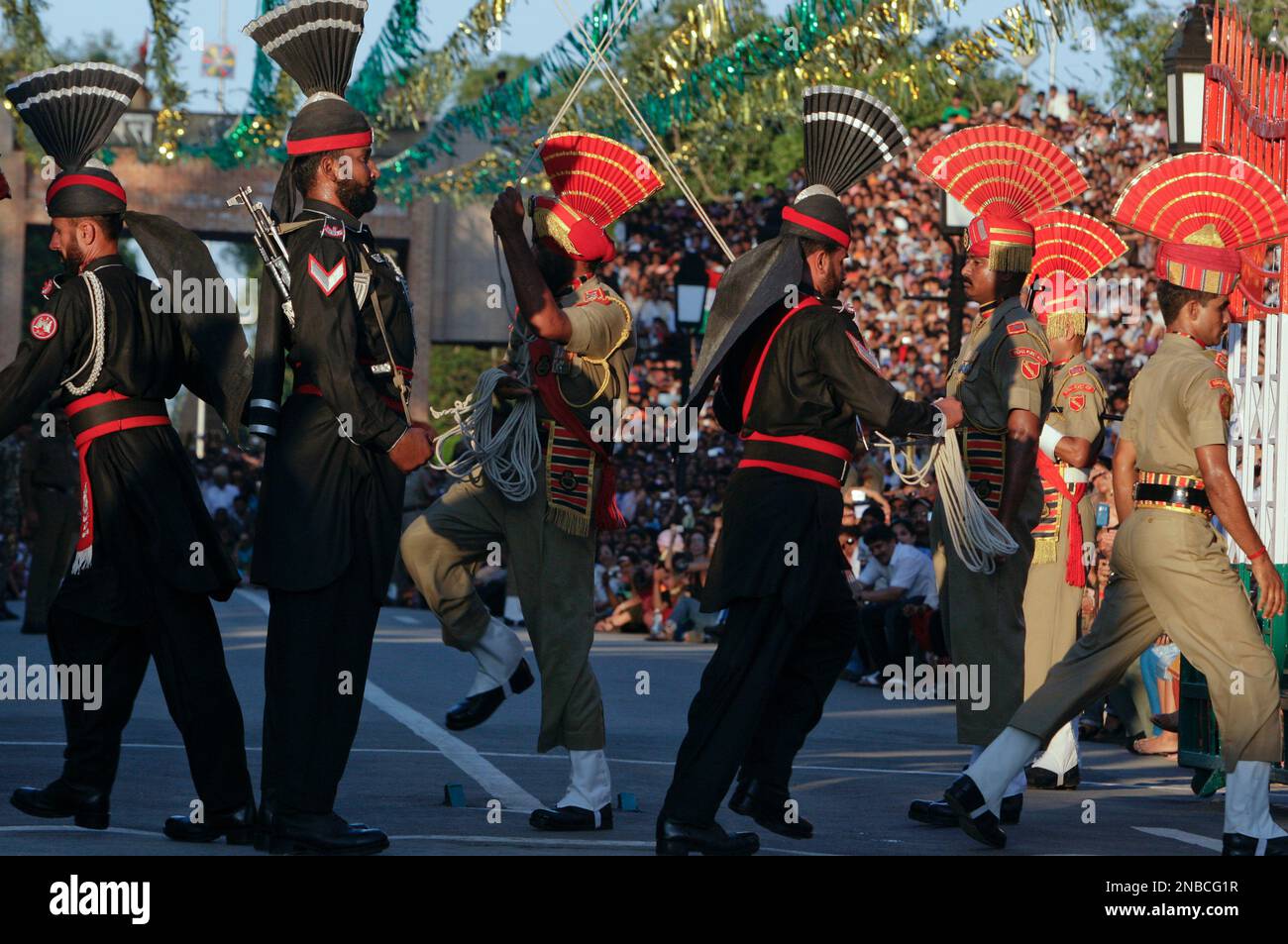 Pakistani Rangers soldiers in black uniform and their Indian ...