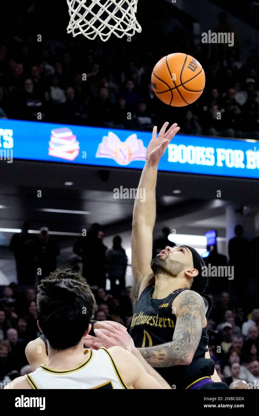 Northwestern guard Boo Buie, right, shoots against Purdue guard Ethan ... Northwestern guard Boo Buie, right, shoots against Purdue guard Ethan ...
