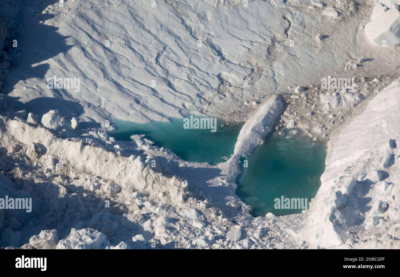 In this July 19, 2011 photo, liquified glacial ice forms into light ...