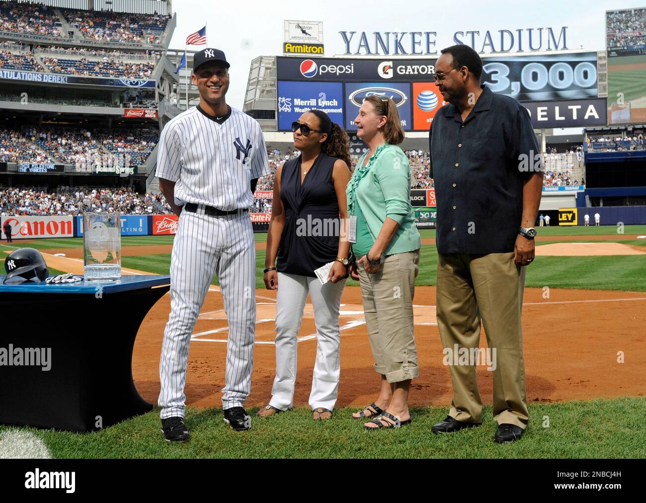 From left to right, New York Yankees' Derek Jeter poses with his sister ...