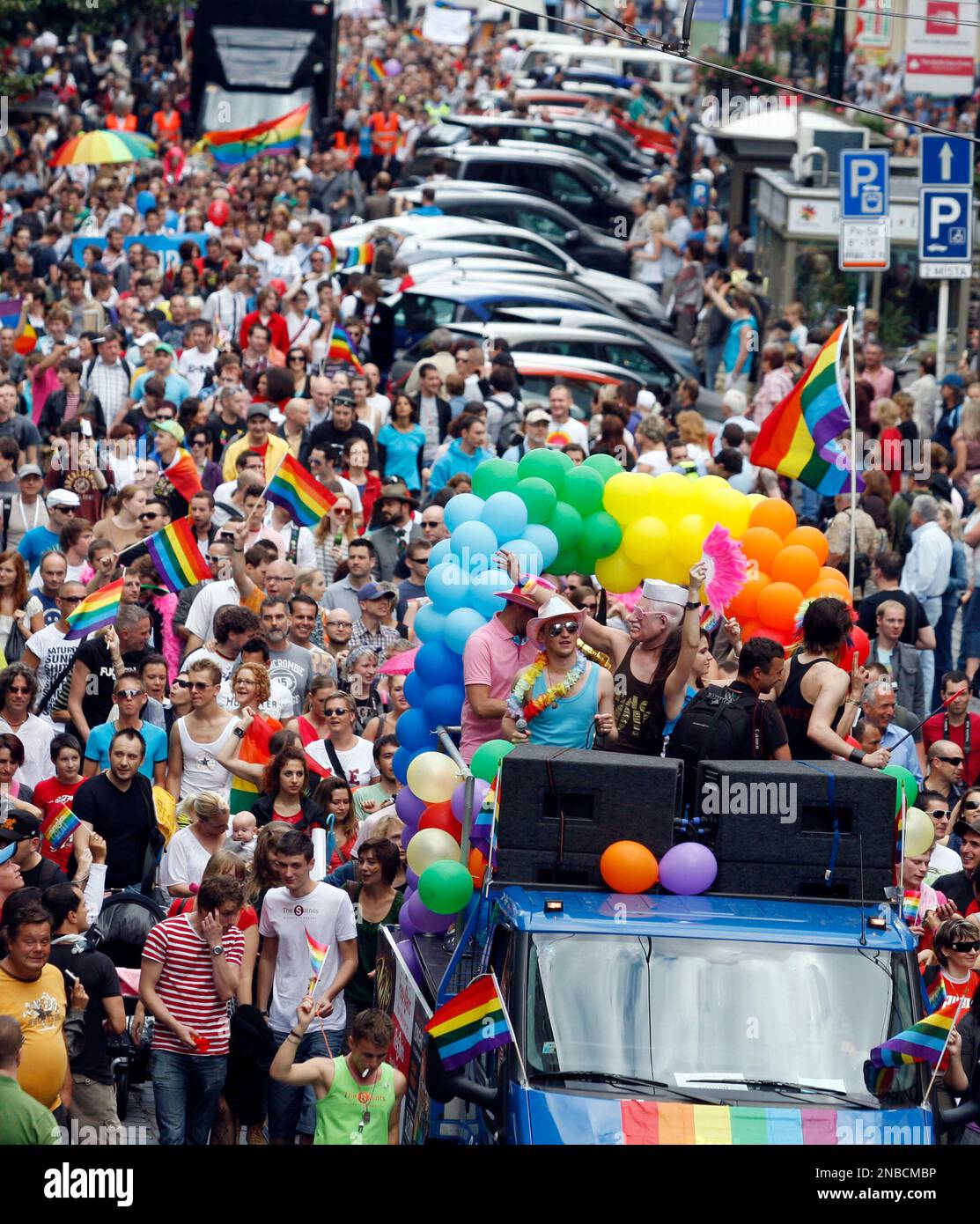 Revellers march during a Gay Pride Parade downtown Prague, Czech Republic, Saturday, Aug. 13 ...