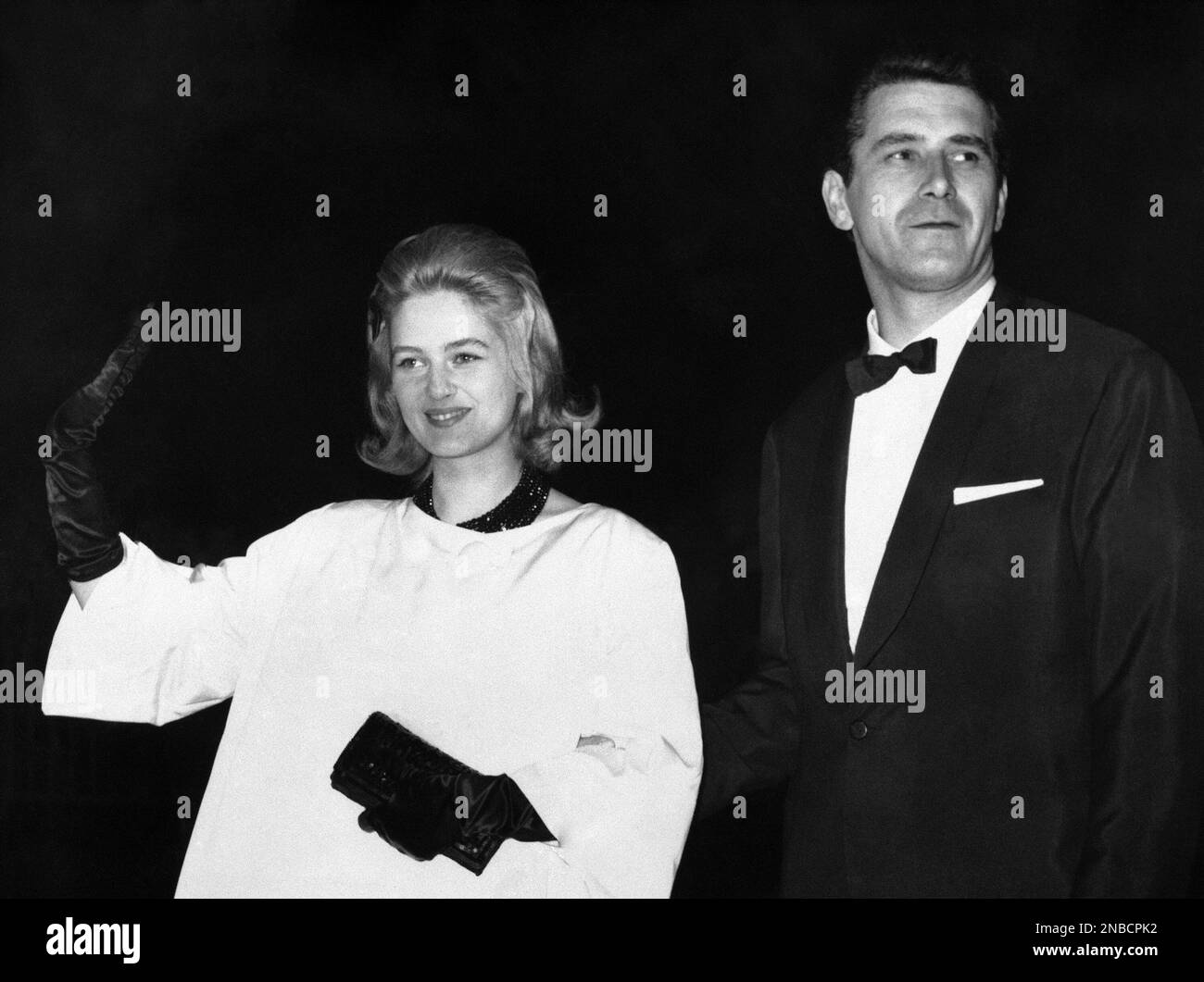 Yugoslav actress Beba Loncar gives a wave as she arrives at the ...