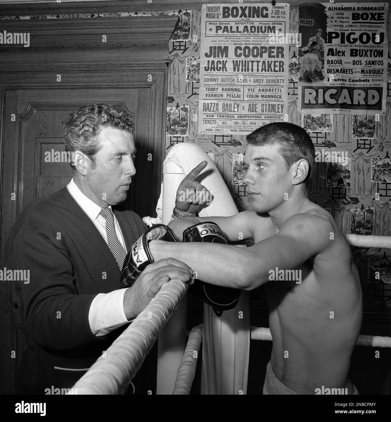 Featherweight Billy Davis, of West Ham, gets some sound advice from his ...