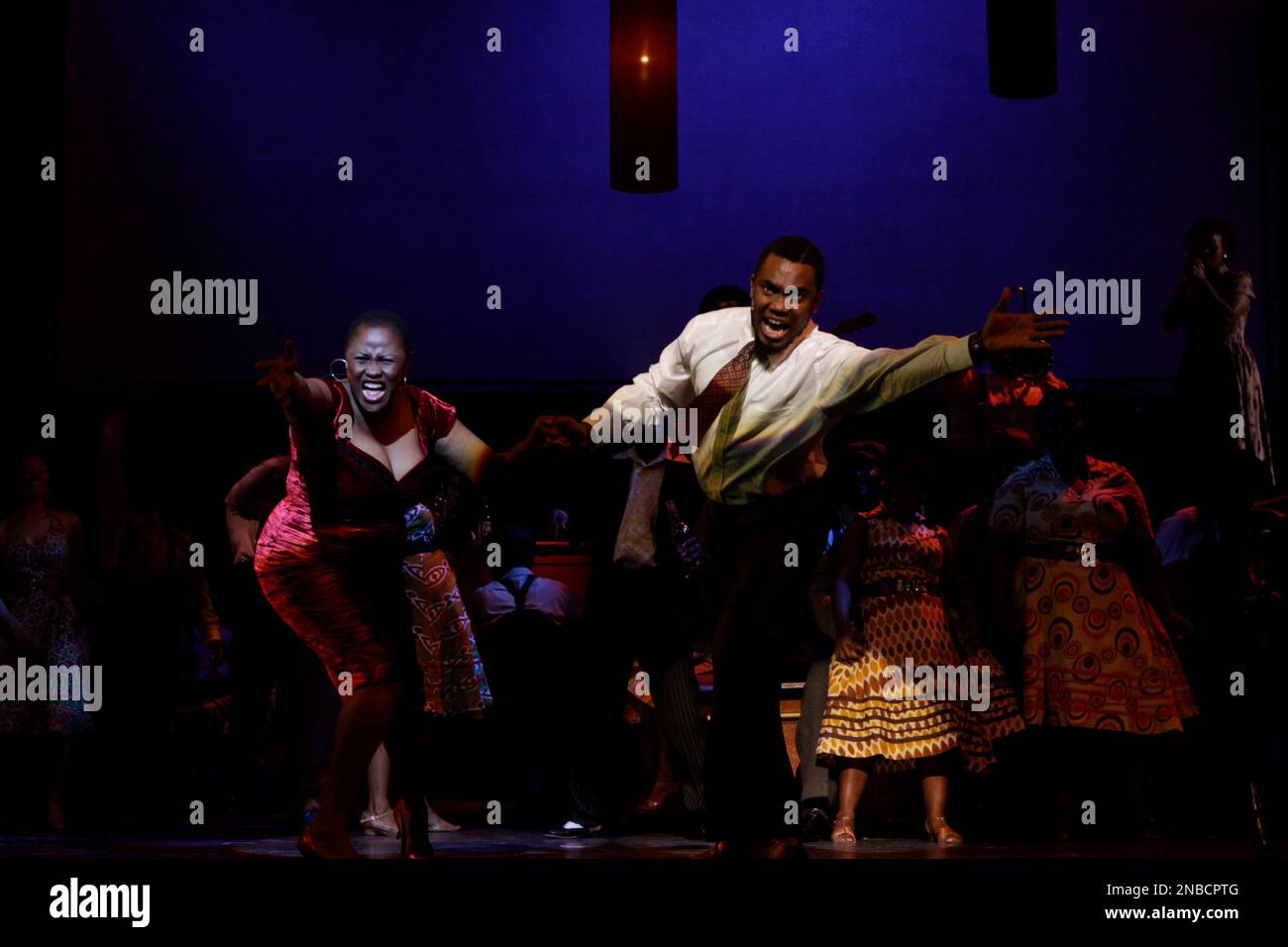 Aubrey Poo, right, playing Nelson Mandela, dances with Gloria Bosman ...