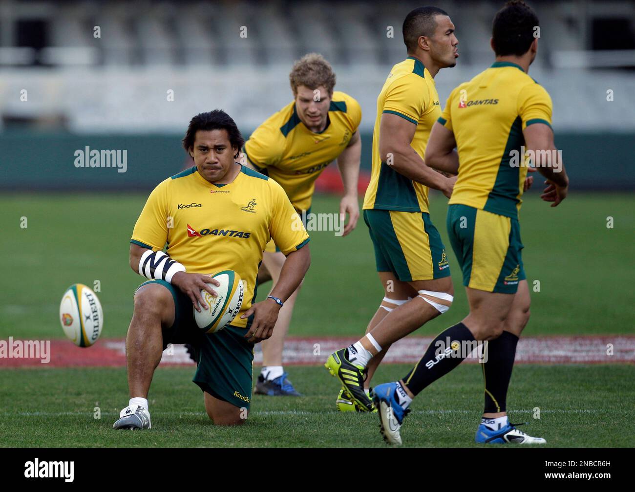 Australia's Salesi Ma'afu, left, looks on during their training at ...
