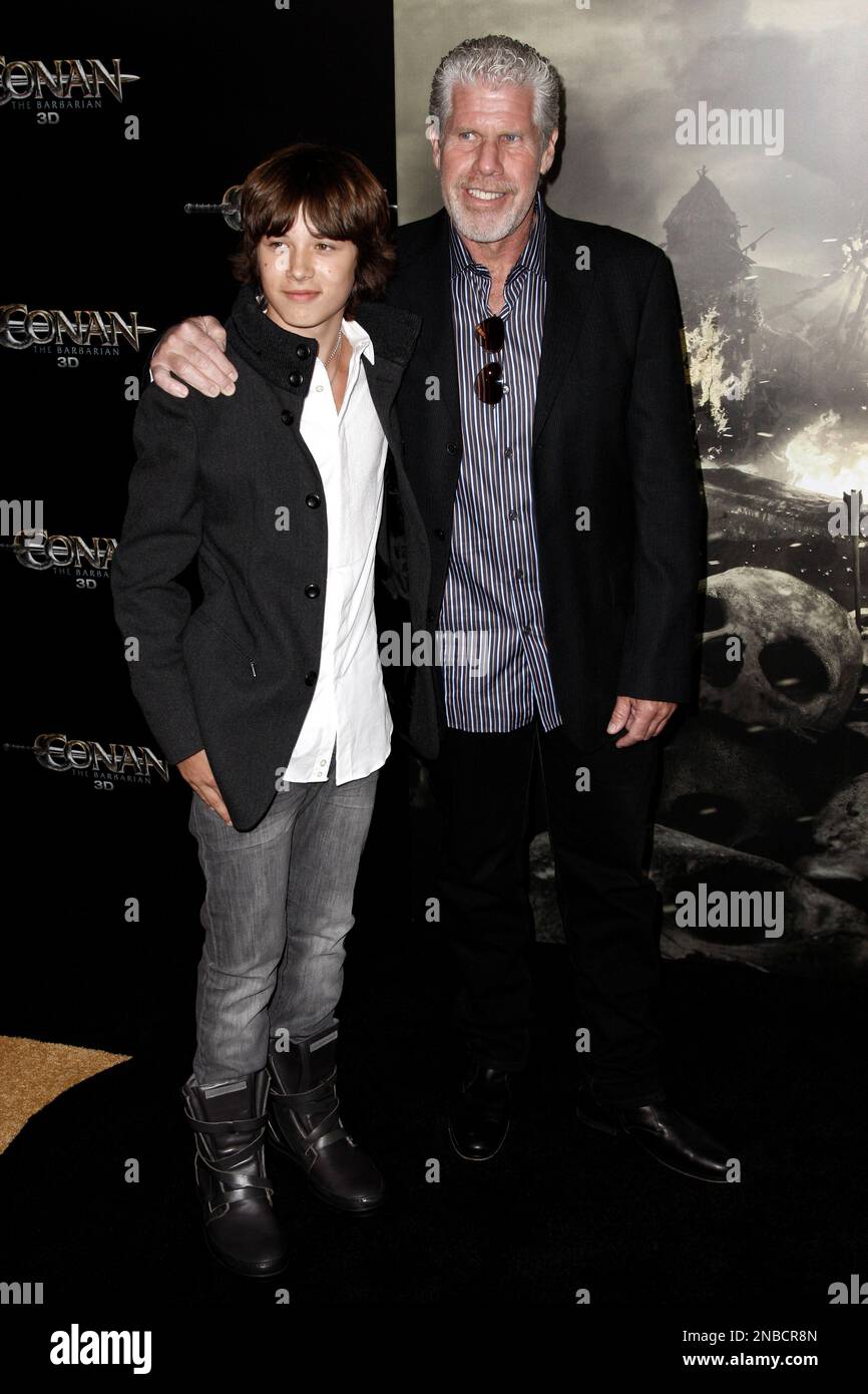 Leo Howard, left, and Ron Perlman pose together at the premiere of ...