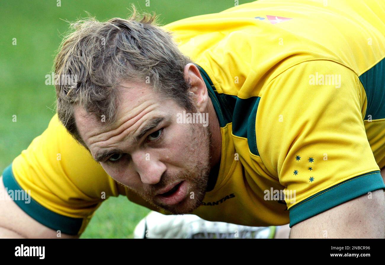 Australia's rugby captain Rocky Elsom looks on as he stretches during ...