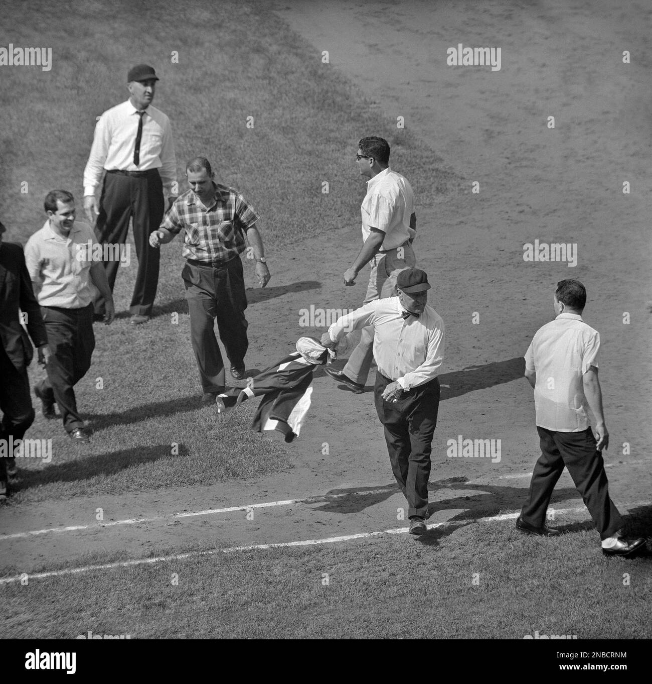 Cuban flag is yanked from marchers on Wrigley Field infield during ...