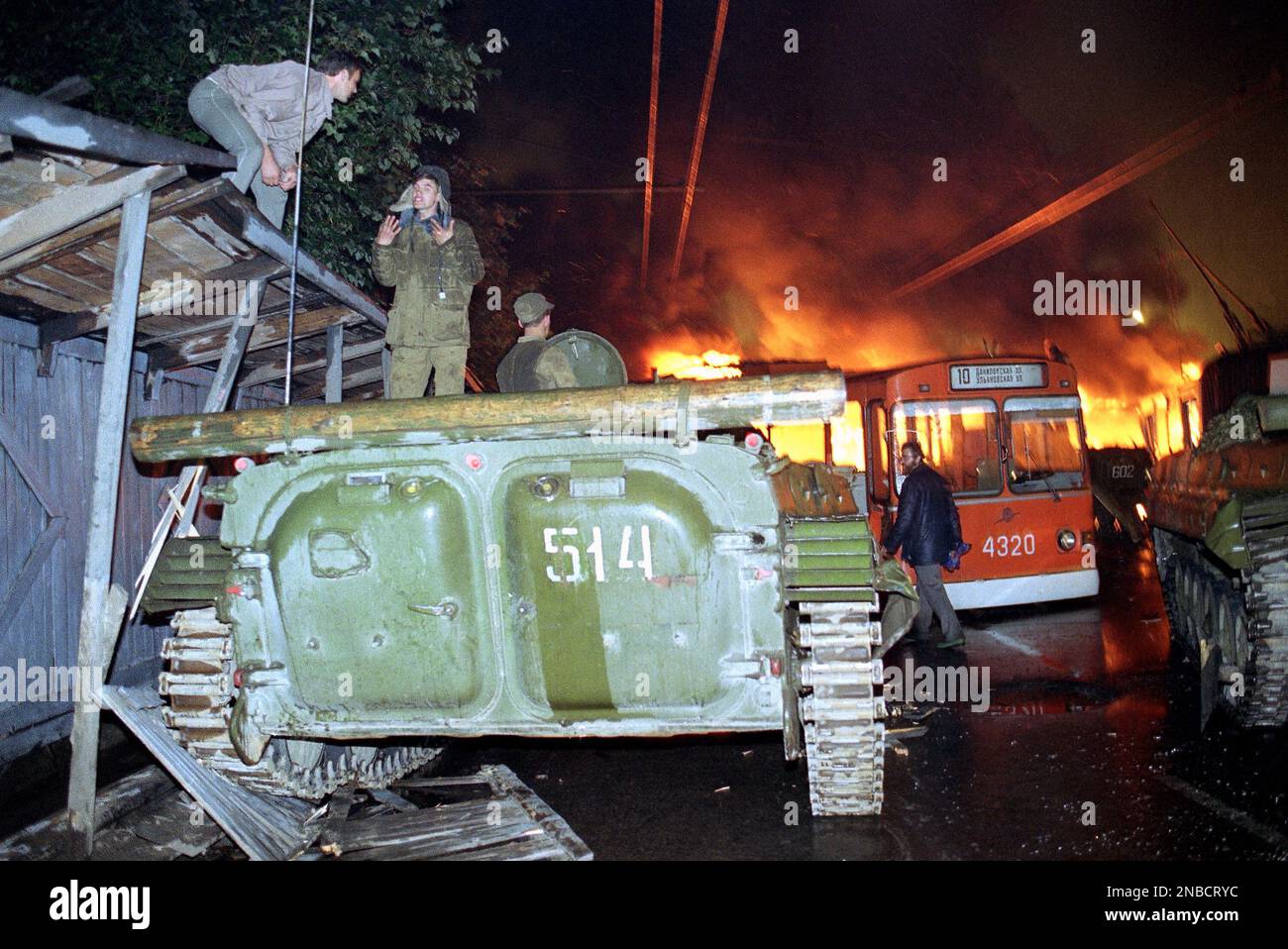 A bus that was used by anti-coup demonstrators to block the exit of ...