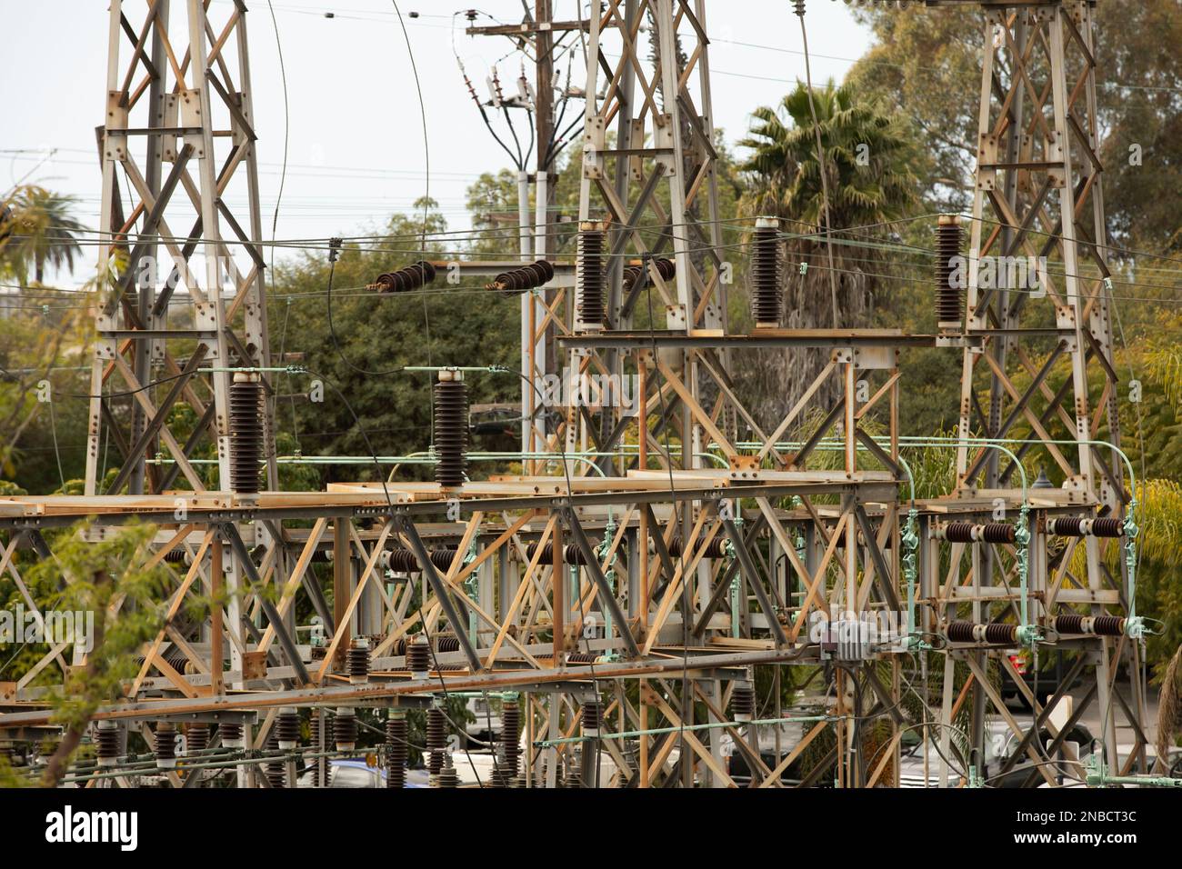 Daytime view of old, rusted crumbling electrical substation ...
