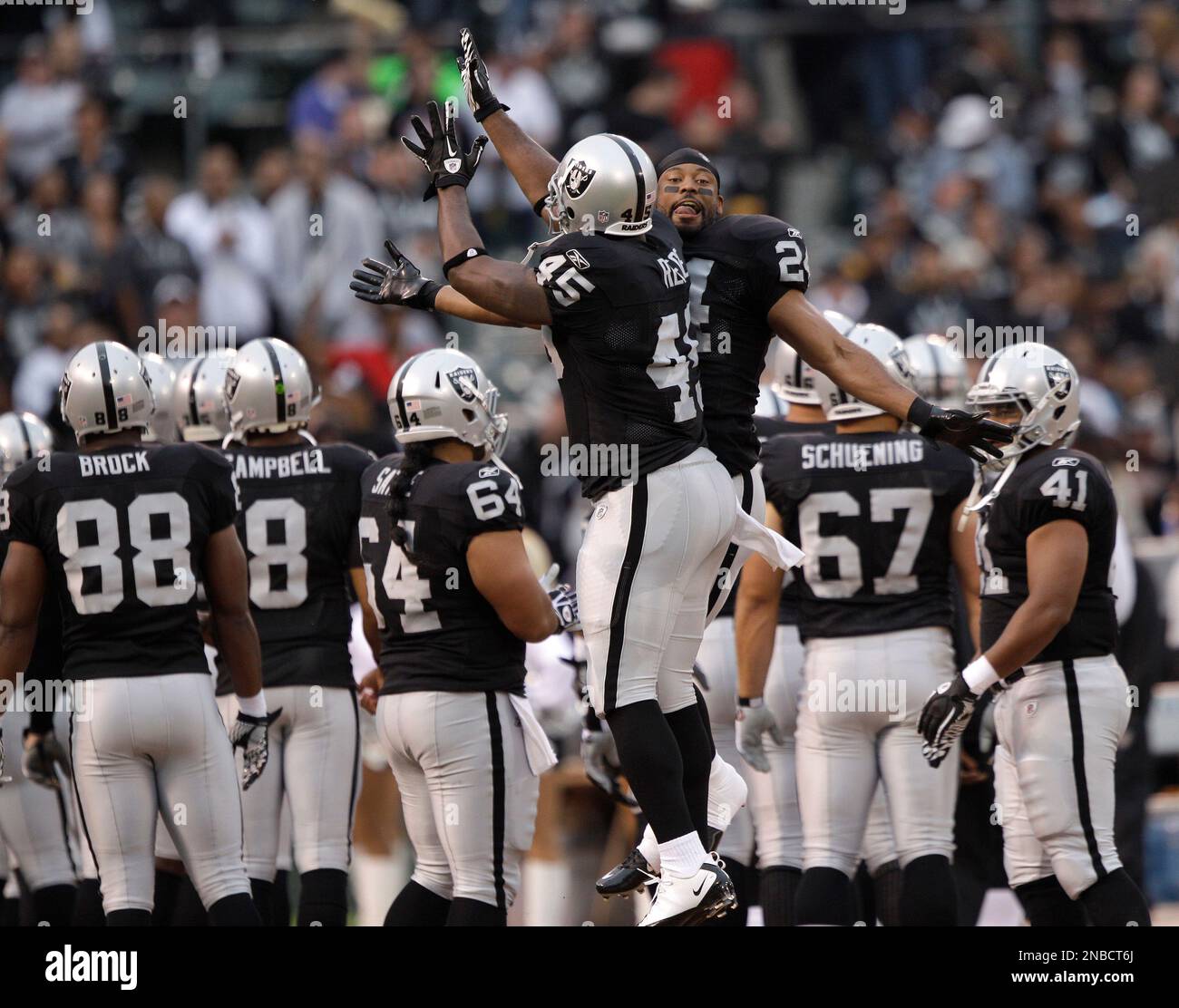 Oakland Raiders fullback Marcel Reece (45) and safety Michael Huff (24 ...