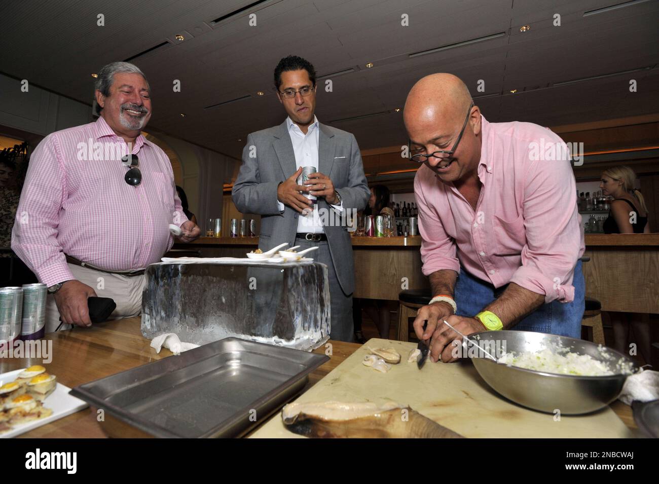 Anthony Dias Blue, left, and Eric Rovner, center, watch as Andrew ...