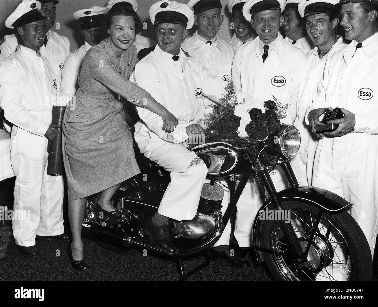 German actress Ilse Werner poses with the winner of the Esso filling ...