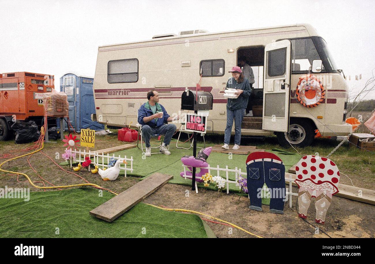 CNN directors Bill Schneider, left, and Melinda Kauffman work outside ...