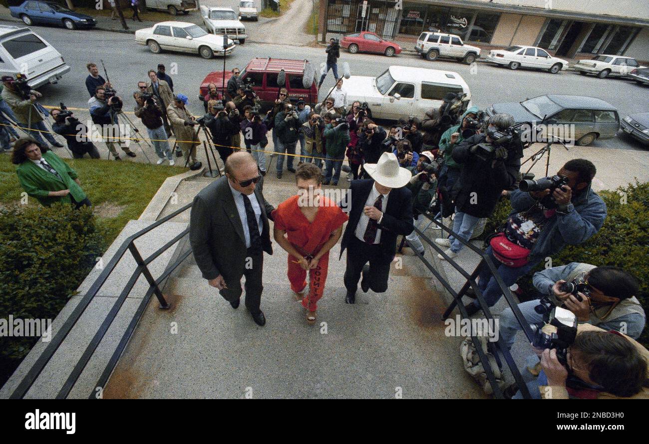 Oliver Gyarfas, a Branch Davidian member, is led past the media into ...