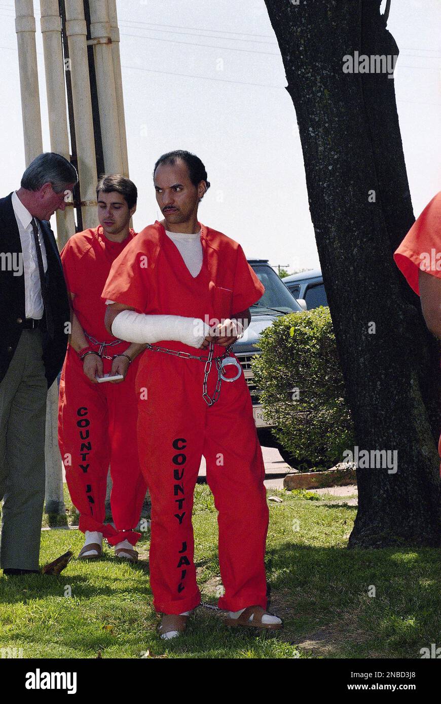 Derek Lloyd Lovelock, right, and Renos Avraam are escorted by a Federal ...