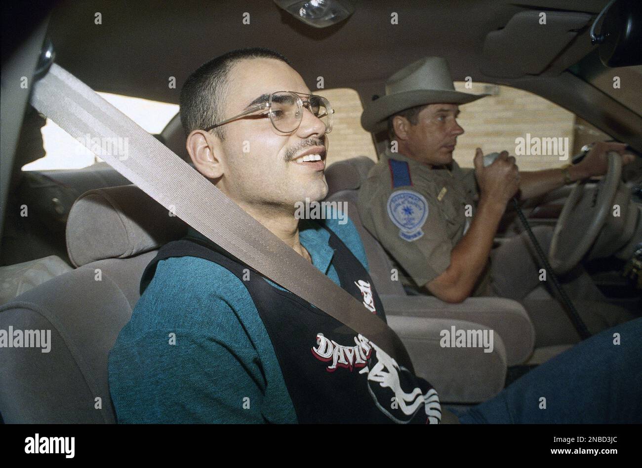 A man identified as Louis Anthony Alaniz, 24, left, arrives at the ...