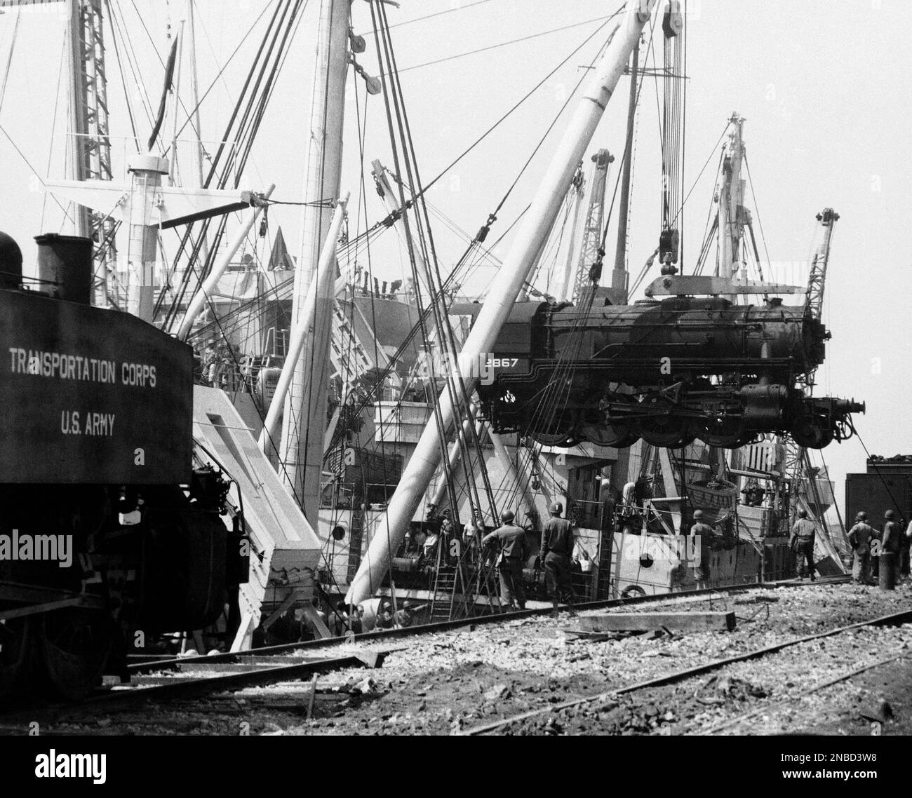 One of the first American made engines to reach France is swung by a ...