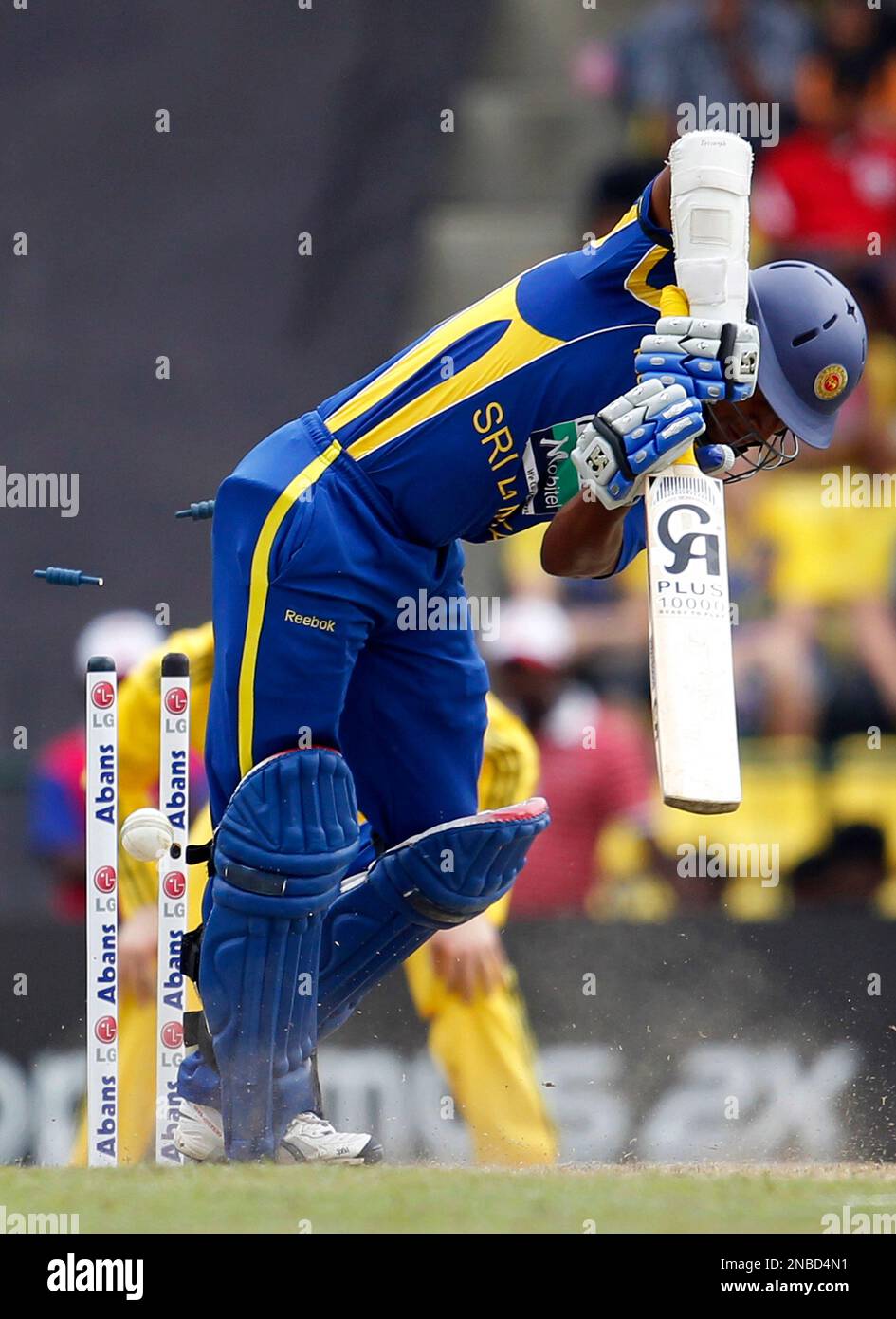 The bails fly off the wicket to dismiss Sri Lankan cricketer Jeevan ...