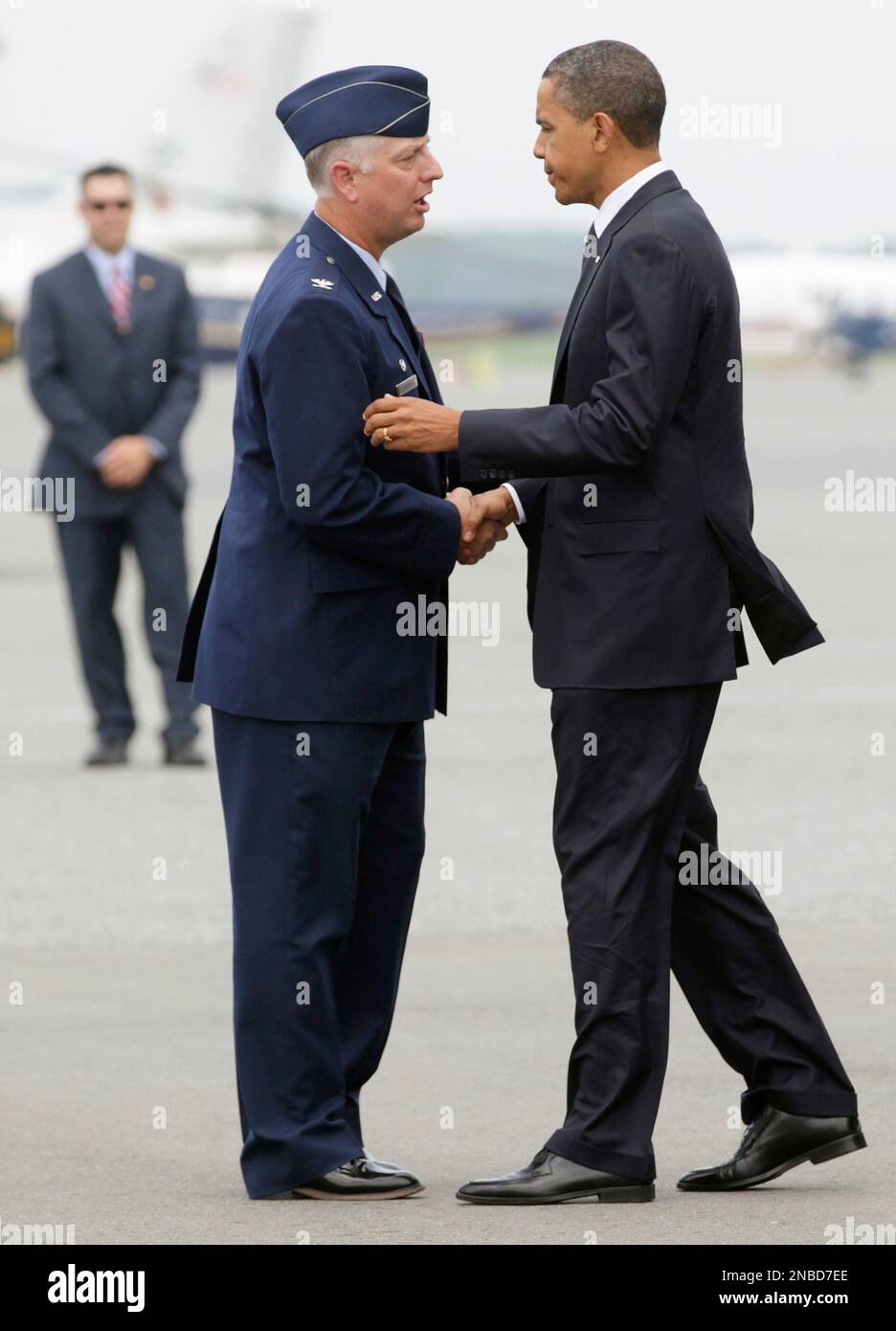 President Barack Obama is greeted by Col. Mark Camerer, the 436th ...