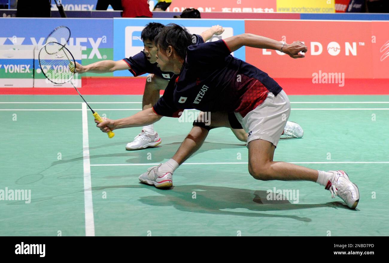 Japan's Shoji Sato and Naoki Kawamae, left, return a shot to Poland's ...