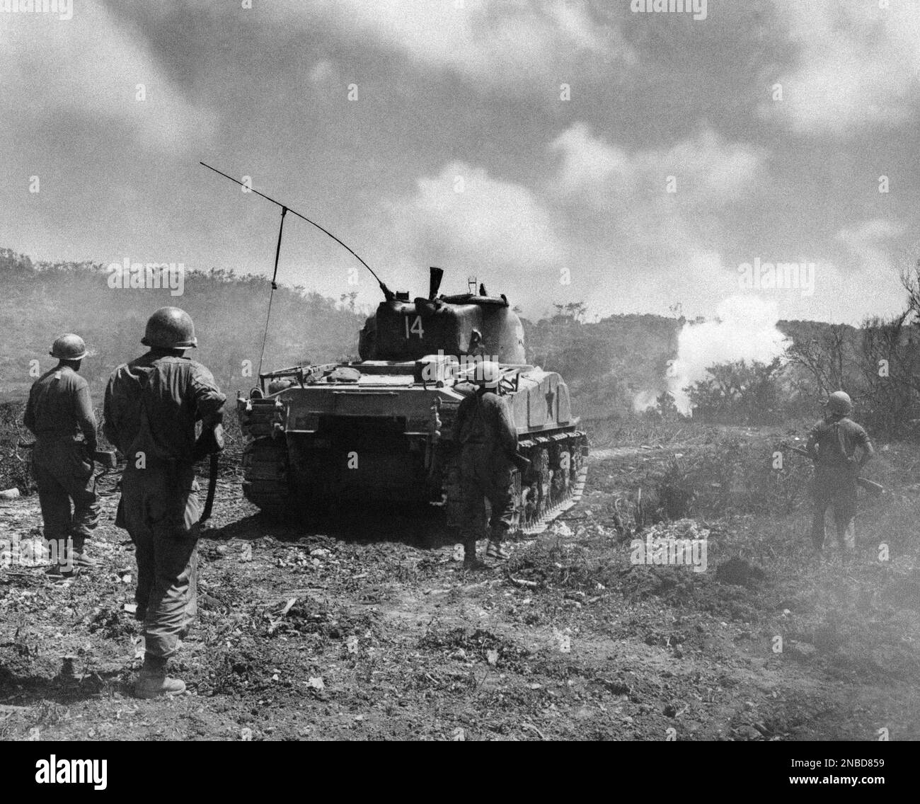 In this image provided by the U.S. Signal Corps, infantrymen of the ...