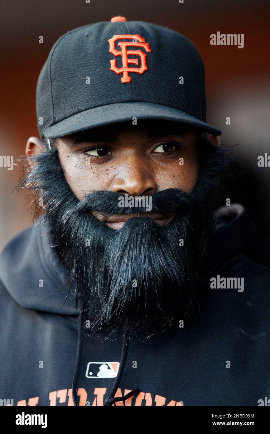 San Francisco Giants relief pitcher Santiago Casilla wears a fake beard ...