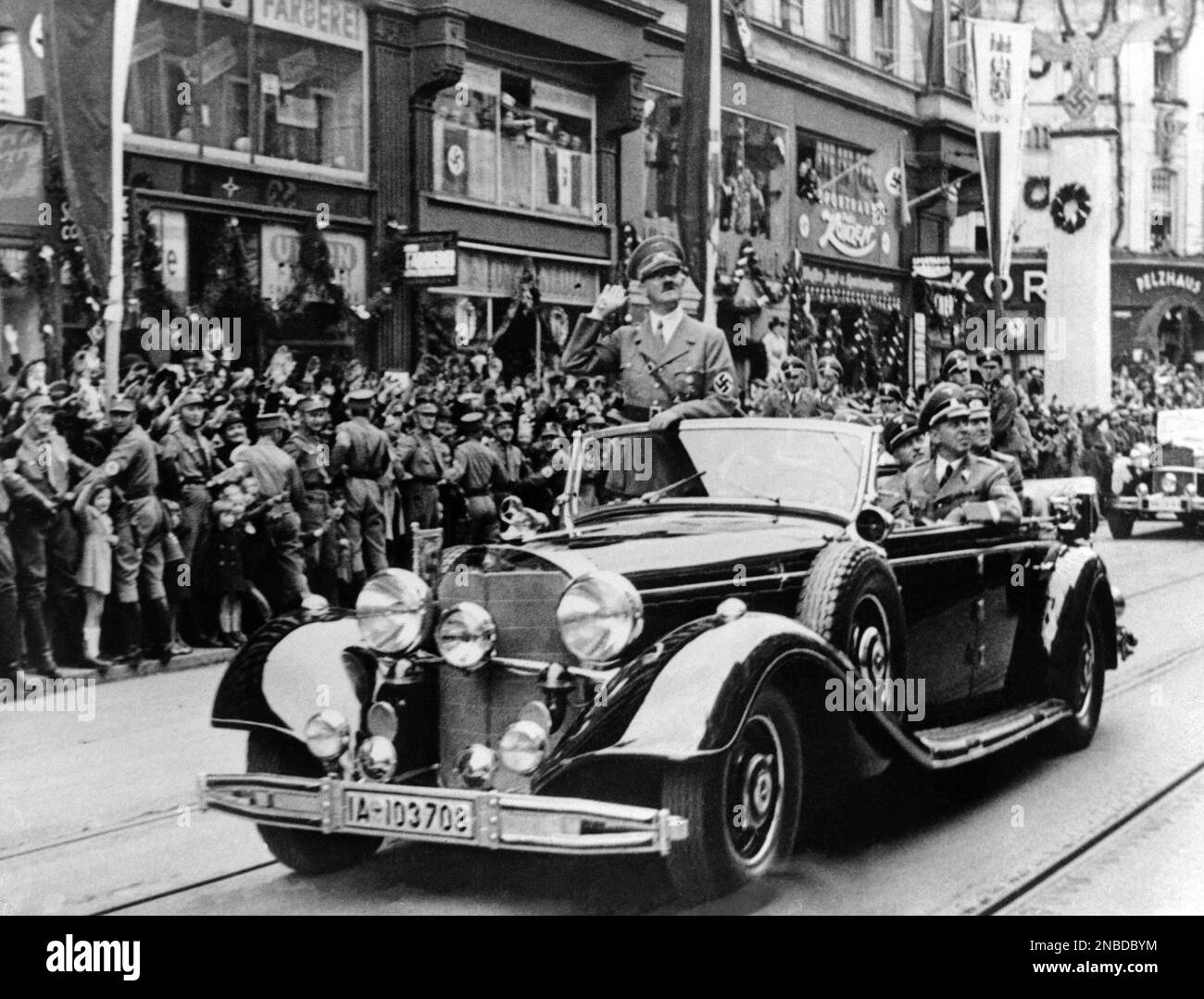 German Chancellor Adolf Hitler saluting to acknowledge the crowd’s ...
