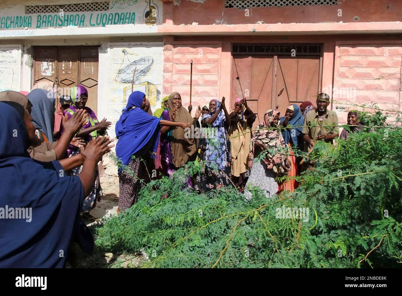 Somali women prepare to clean streets in the neighborhoods vacated by ...