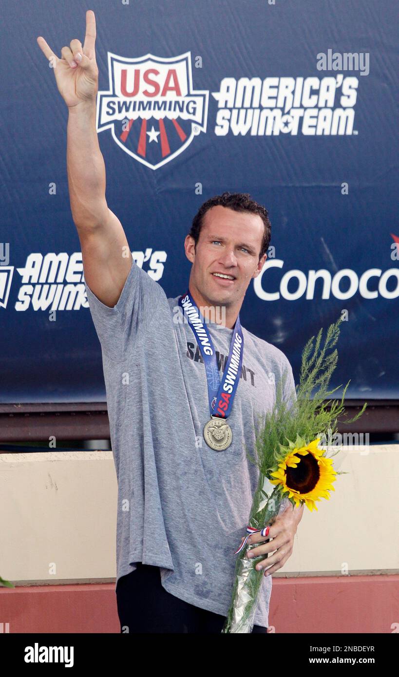 Brendan Hansen celebrates on the podium after his win in the men's 200 ...