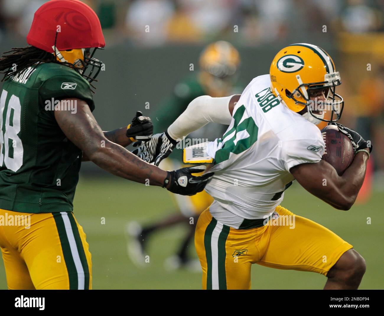 Green Bay Packers' Randall Cobb tries to get past Cardia Jackson on a ...
