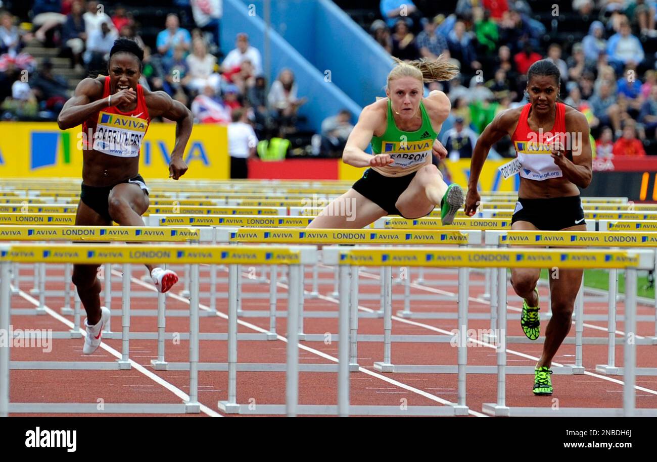 Australia's Sally Pearson, centre, leads with US Danielle Carruthers ...