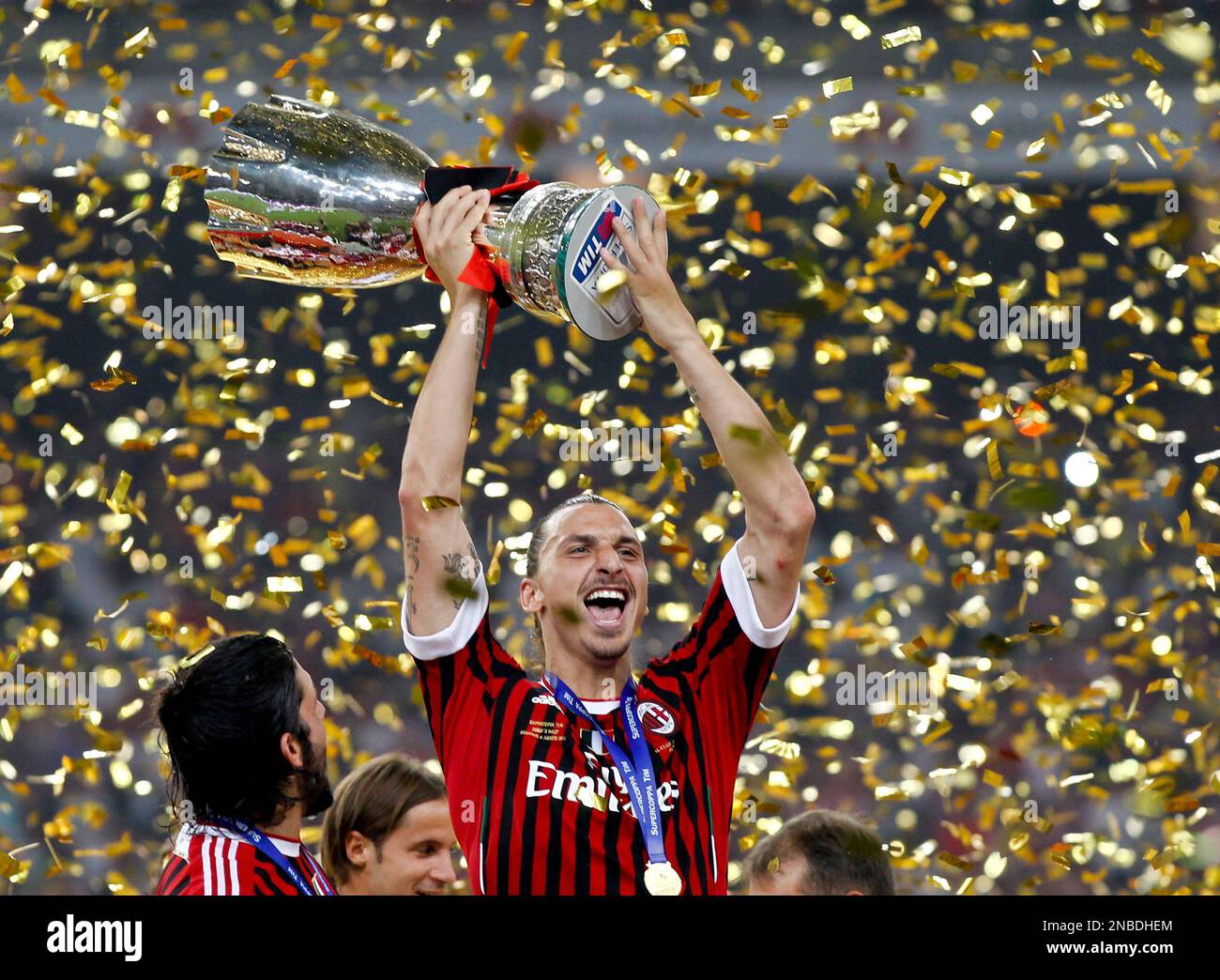 AC Milan's forward Zlatan Ibrahimovic holds the Italian Super Cup ...