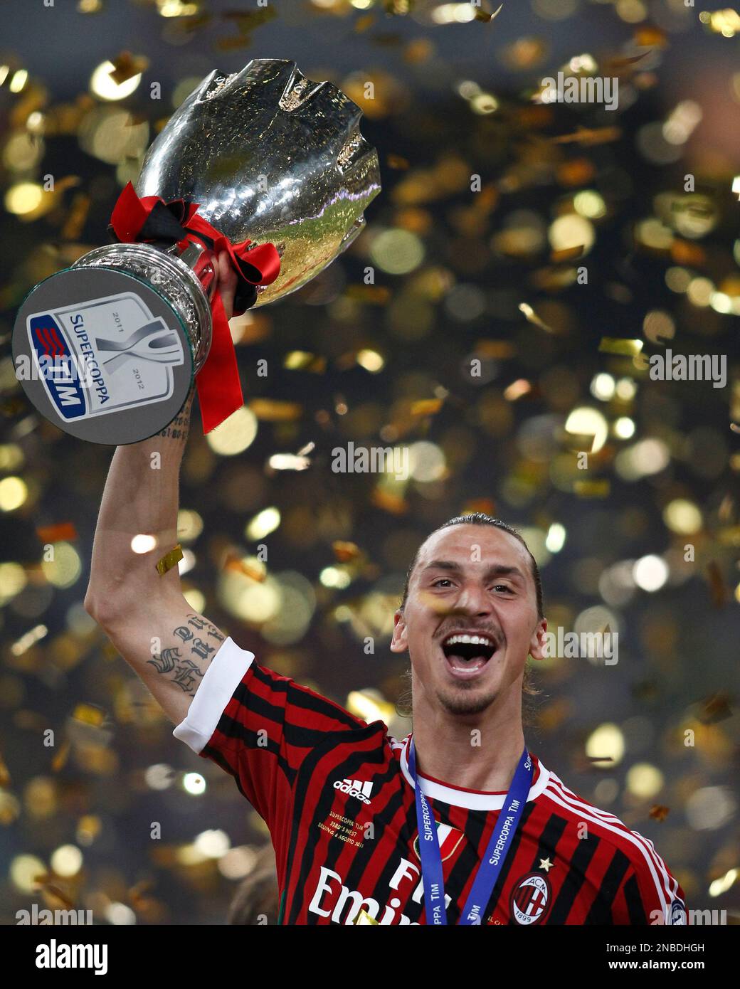 AC Milan's forward Zlatan Ibrahimovic holds the Italian Super Cup ...