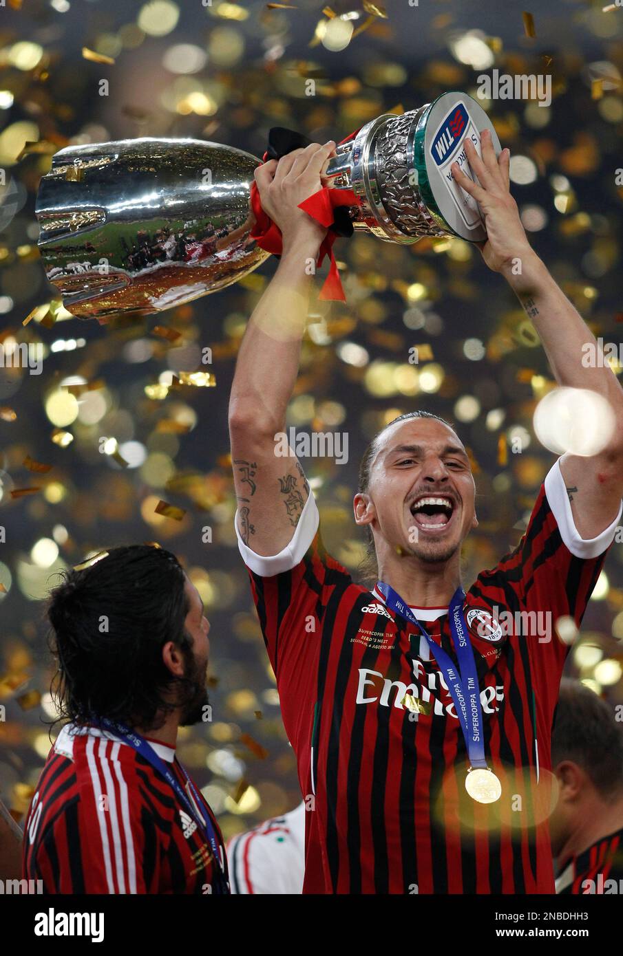 AC Milan's forward Zlatan Ibrahimovic holds the Italian Super Cup ...
