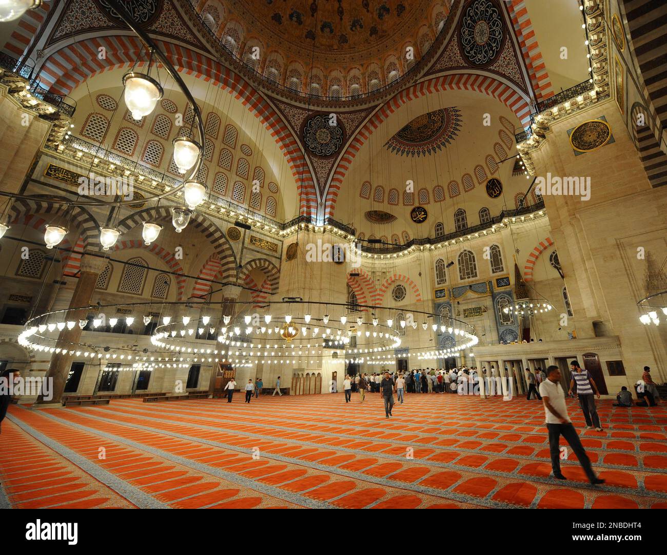 People are seen inside the Ottoman-era Suleymaniye Mosque with some of ...