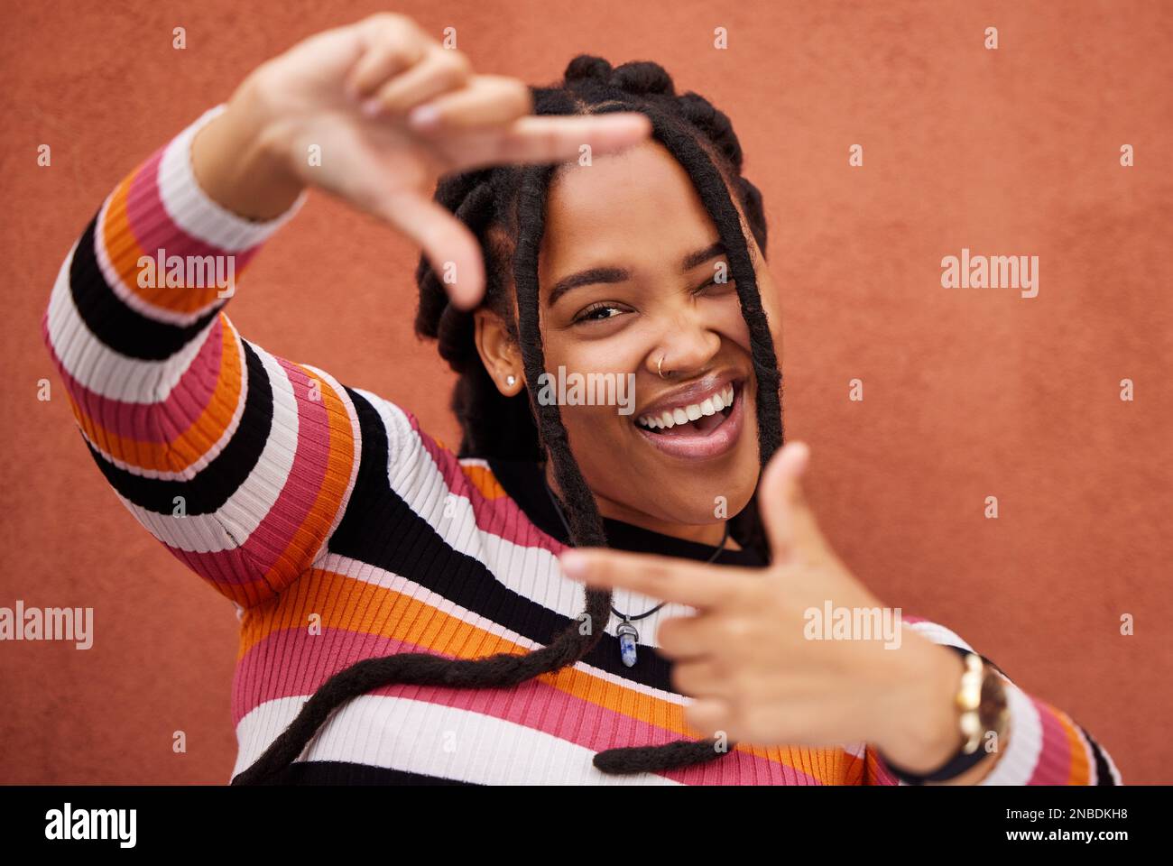 Finger framing, portrait and black woman on background for profile ...