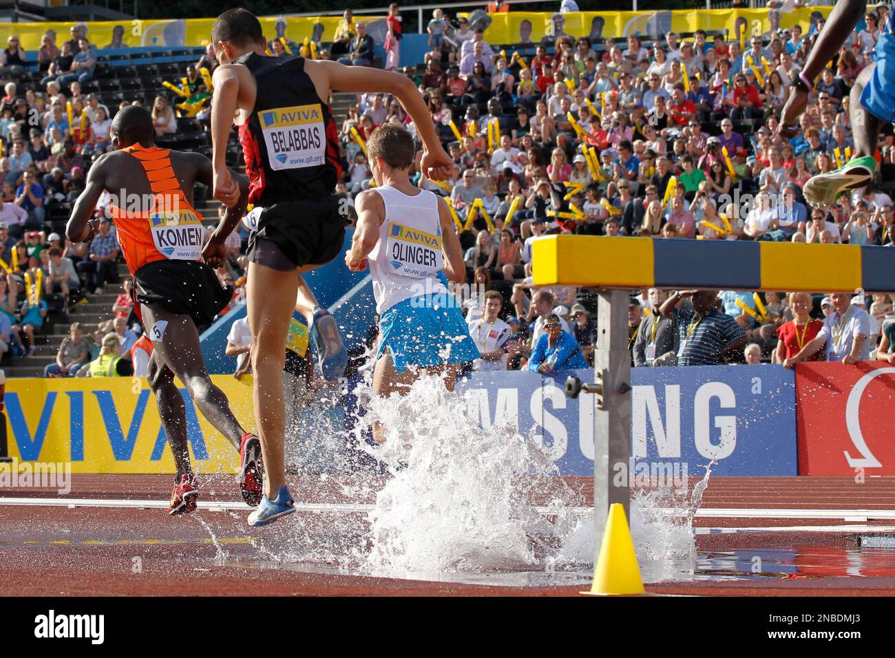 Kenya's Willy Rutto Komen, left, leads France's Mohamed-Khaled Belabbas ...