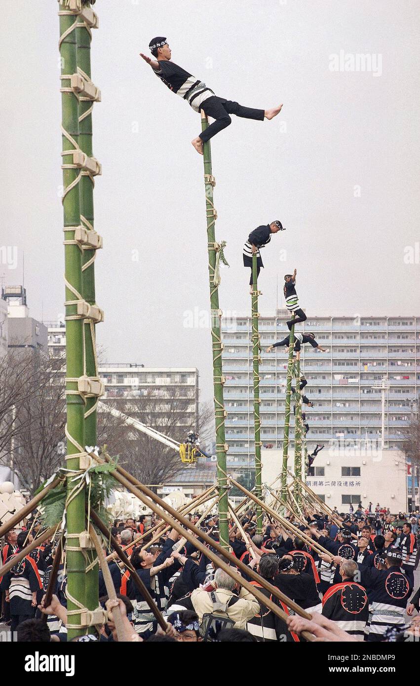 Dressed in a traditional firefighter’s outfit, members of the ...