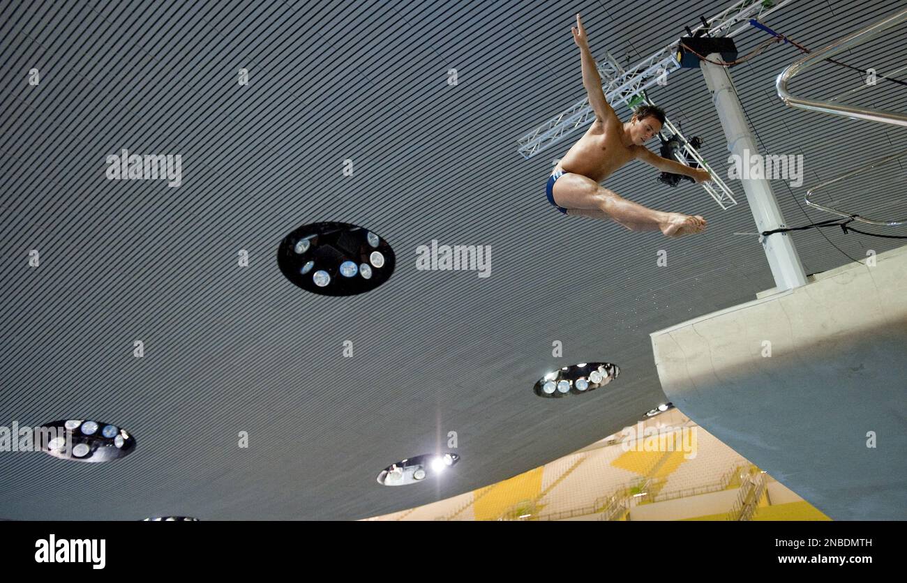 British Olympic diver Tom Daley performs a dive into the new aquatic ...