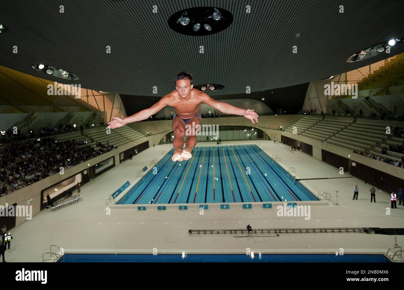 British Olympic diver Tom Daley performs a dive into the new aquatic ...