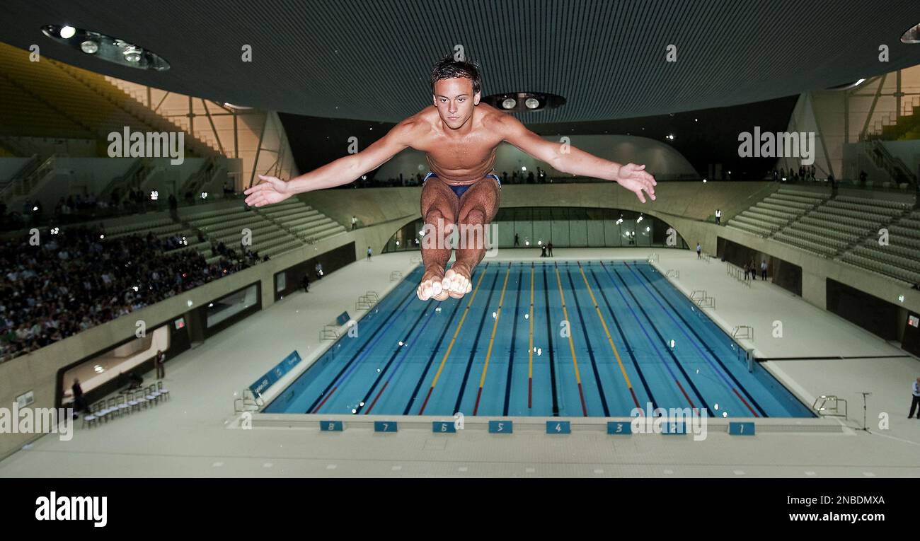 British Olympic diver Tom Daley performs a dive into the new aquatic ...
