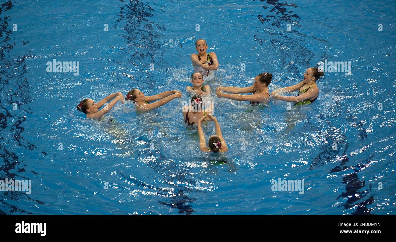 A synchronized swimming display takes place in the new aquatic centre ...