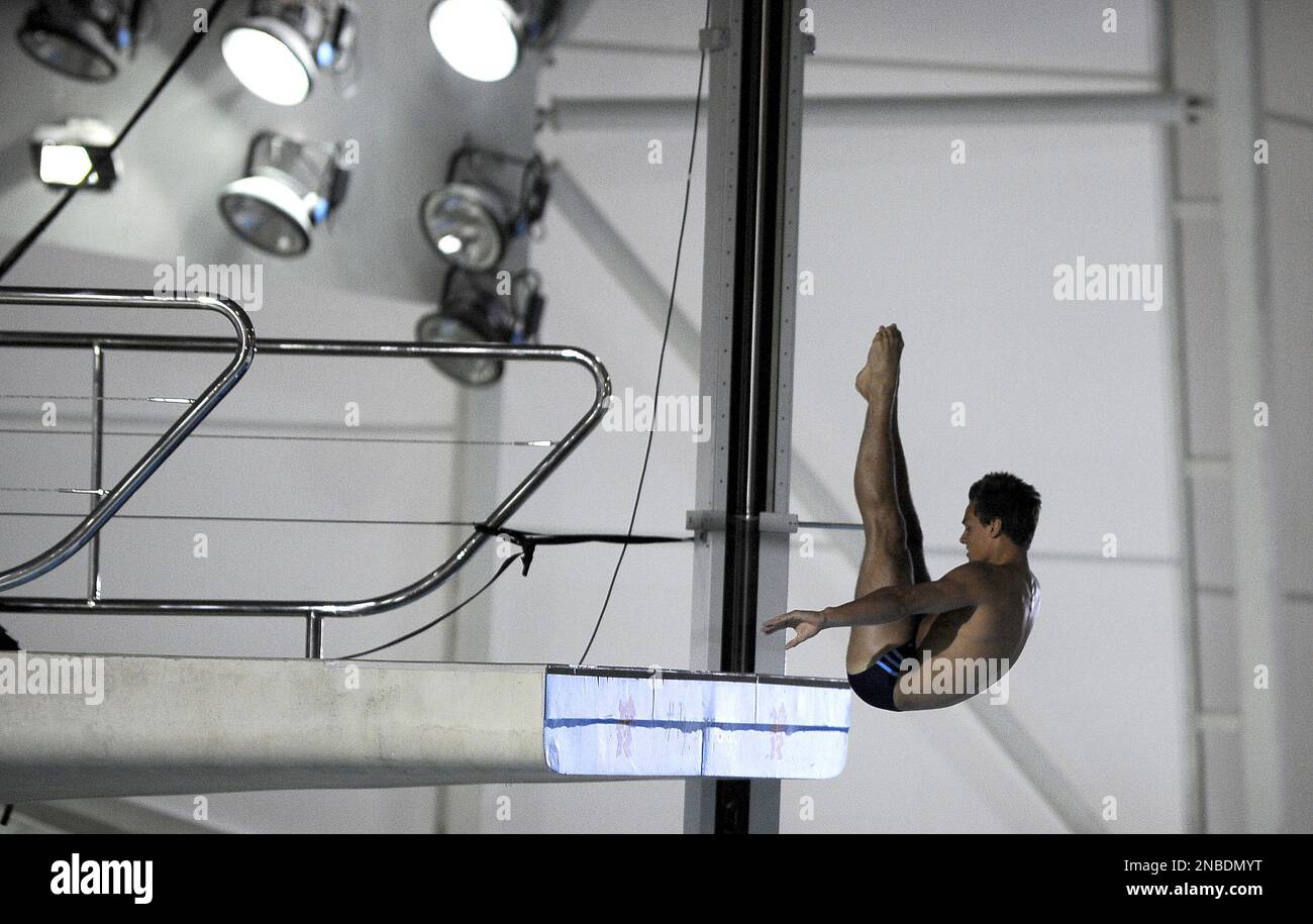 British Olympic diver Tom Daley performs a dive into the new aquatic ...