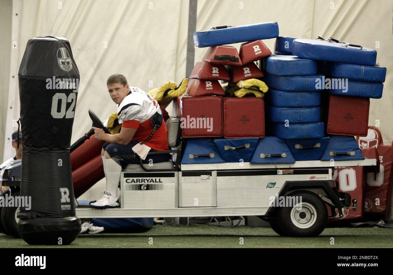 Houston Texans long snapper Jon Weeks sits on a cart before the start ...