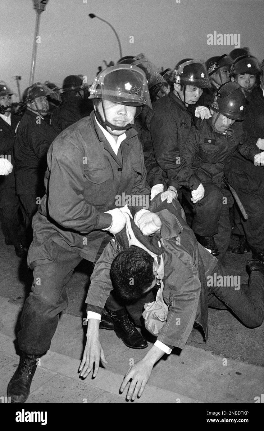 Helmeted riot police grapple with “Zengakuren” students near the ...