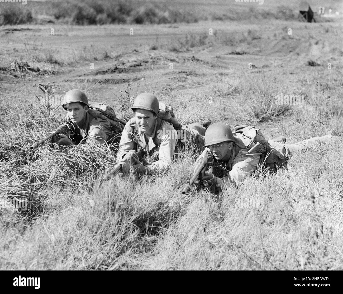 Three Iowa boys familiarize themselves with the Browning automatic ...